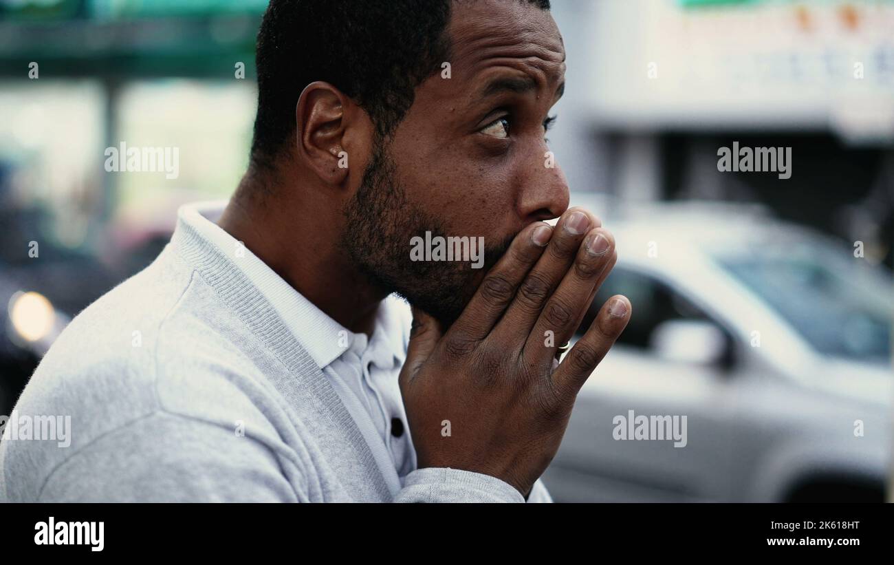 One spiritual young black man praying in street having HOPE and FAITH ...