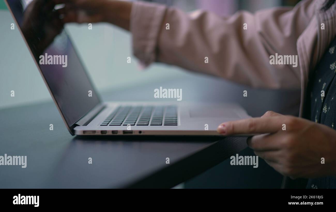 One young hispanic woman opening laptop in coffee shop remote workplace ...