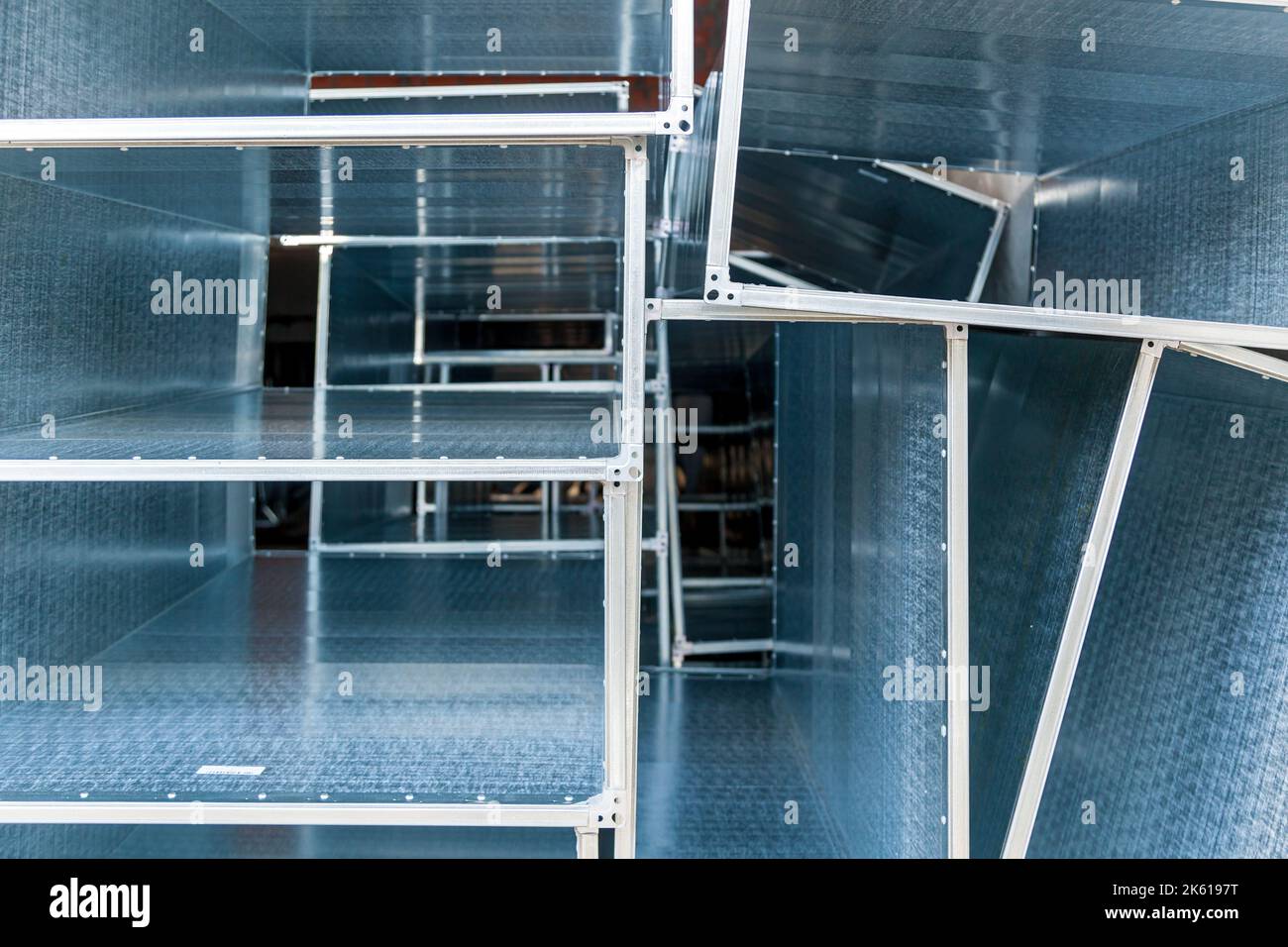 Shiny metal industrial stainless steel pipes for ventilation on a ...