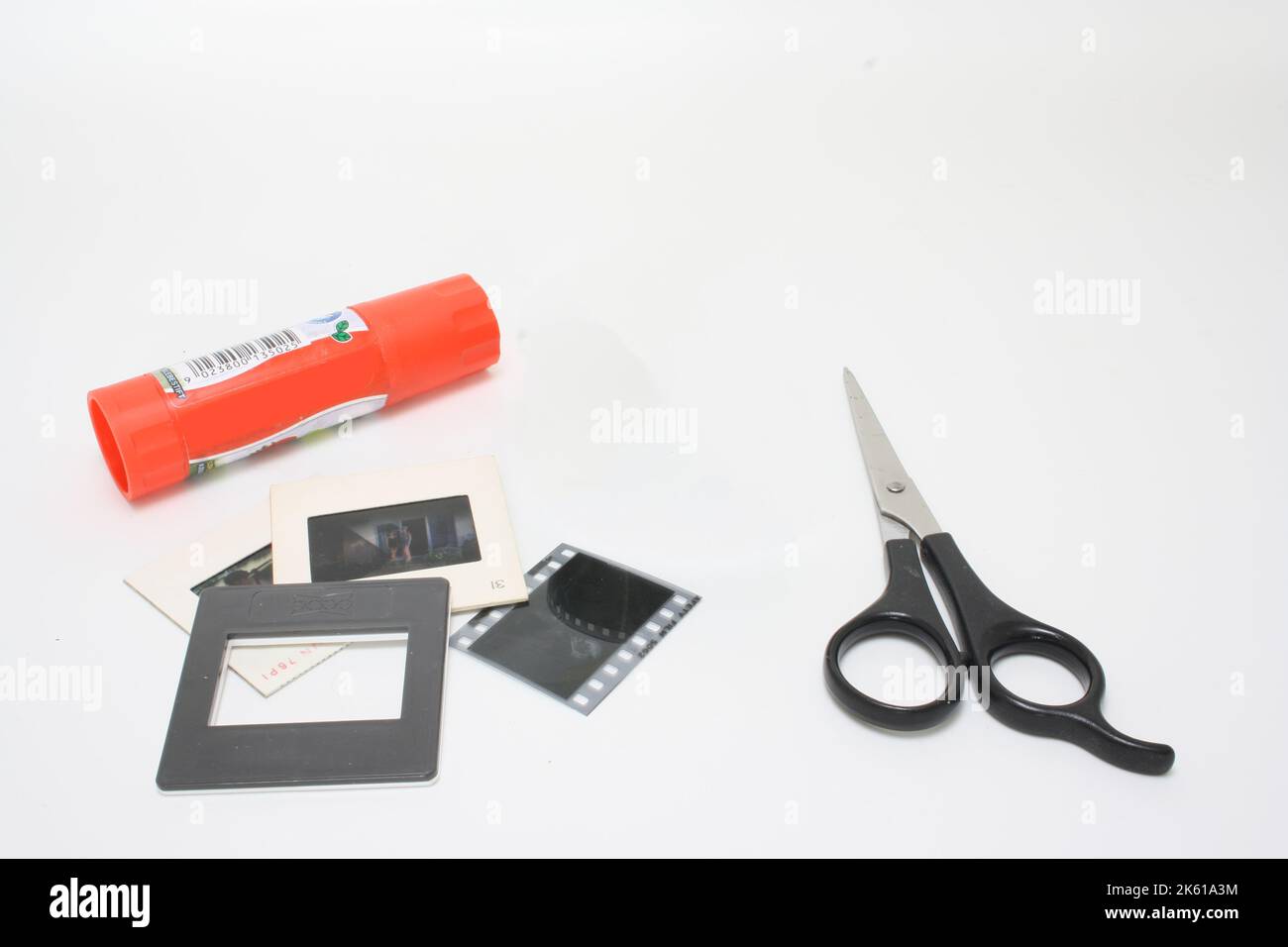 Slide film frames and scissors isolated on the white background Stock ...