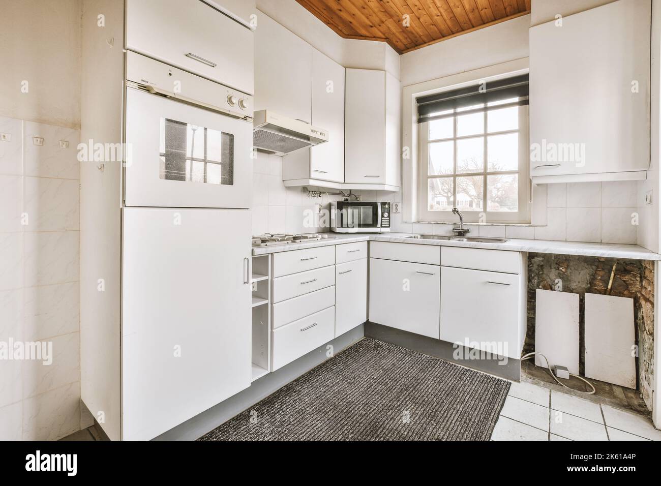 Old fashioned cupboards in light kitchen of classic flat Stock Photo ...
