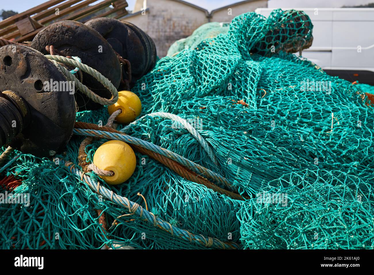 Bunch of fishing colorful nets in daytime in port Stock Photo - Alamy