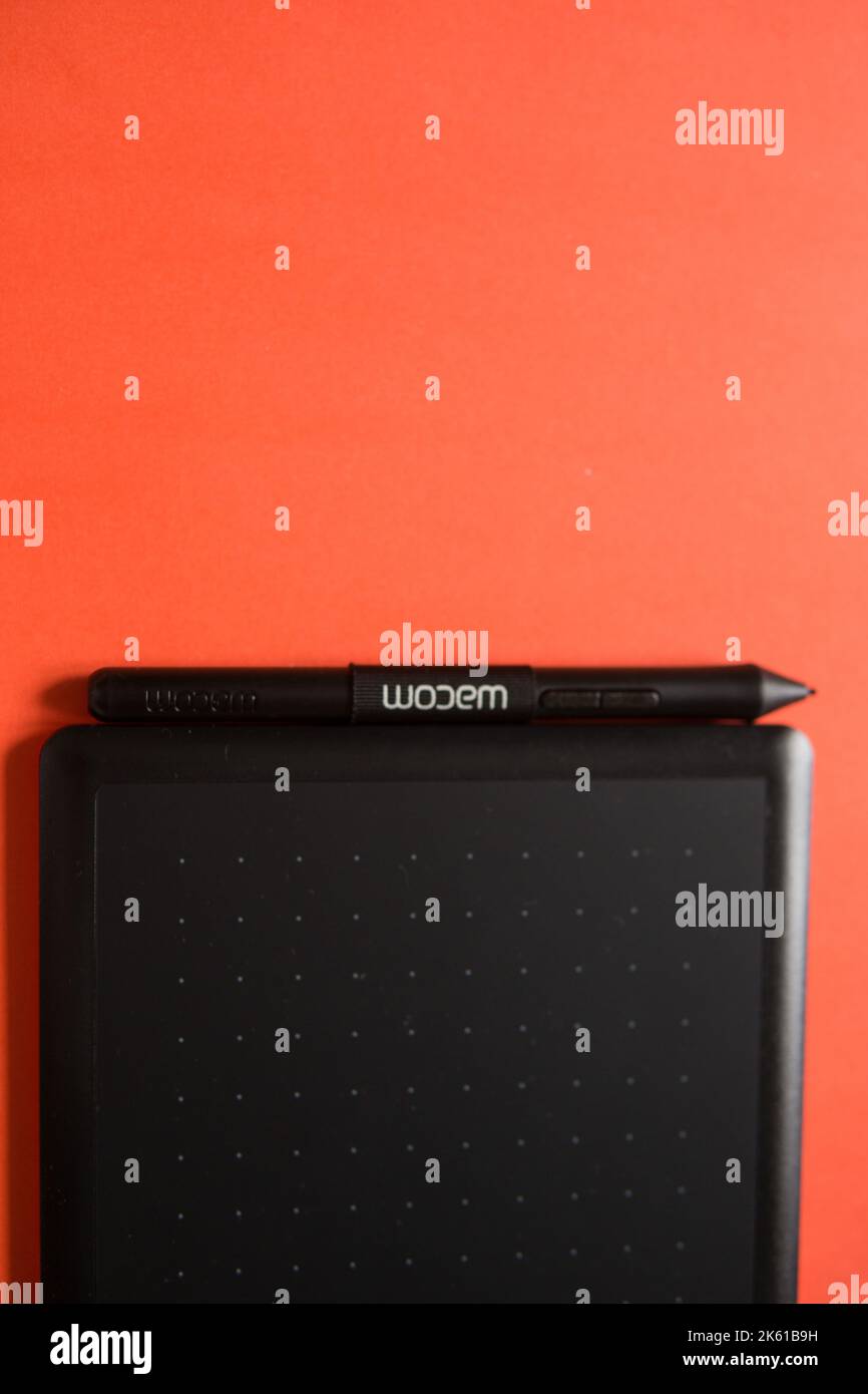 Tver, Russia - February 3, 2020 Top view of Wacom graphic tablet on red ...