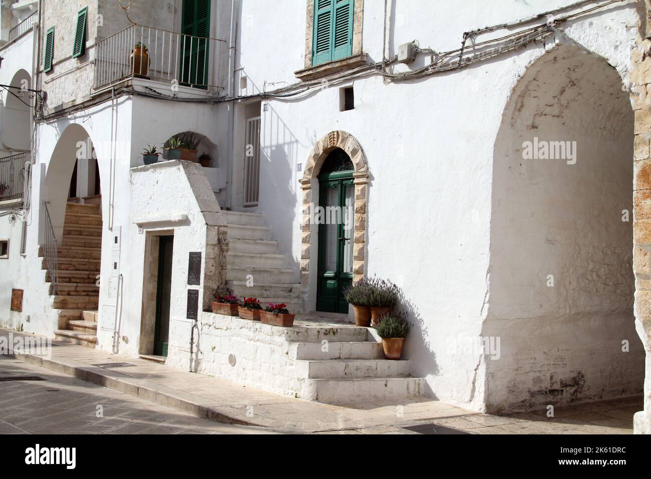 Cisternino, Puglia, Italy. Whitewashed stone buildings with outer ...