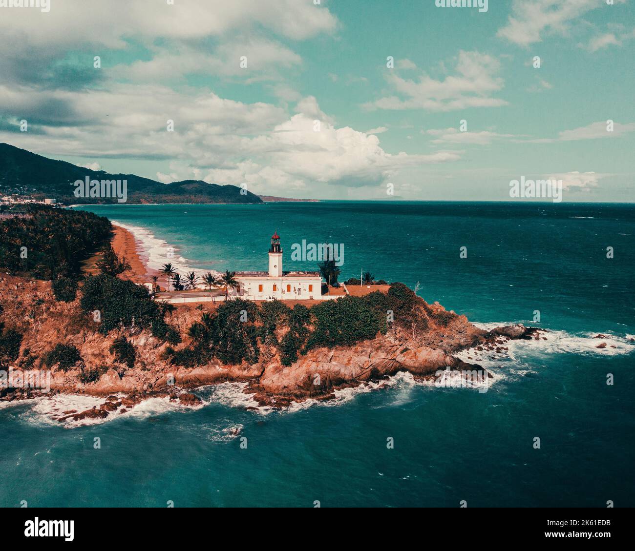 Old Lighthouse right on the coast from puerto rico Stock Photo - Alamy