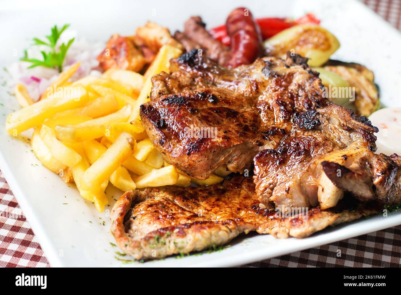 Traditional Balkan mixed grill dish - different types of bbq meat and ...