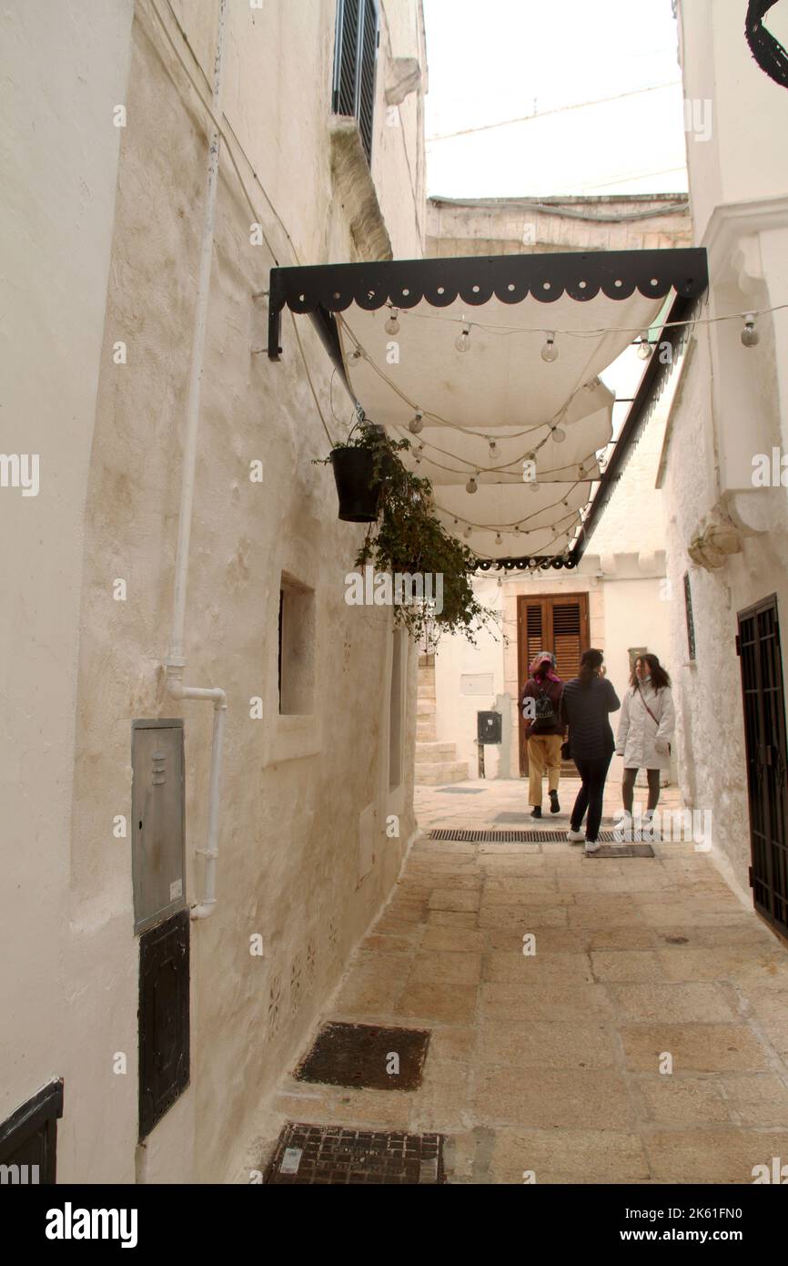 Cisternino, Puglia, Italy. Narrow alleyway between buildings in the ...