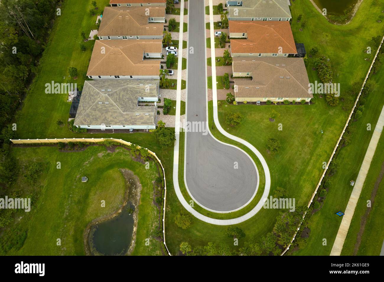 Aerial view of cul-de-sac at neighborhood street dead end with tightly ...
