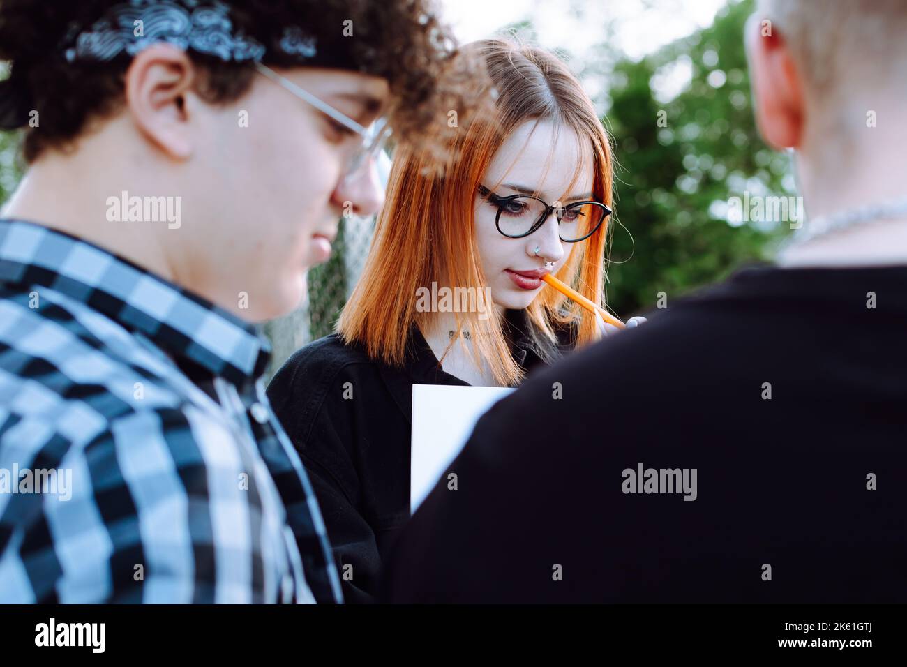Portrait of cute thinking female redhaired university or college ...