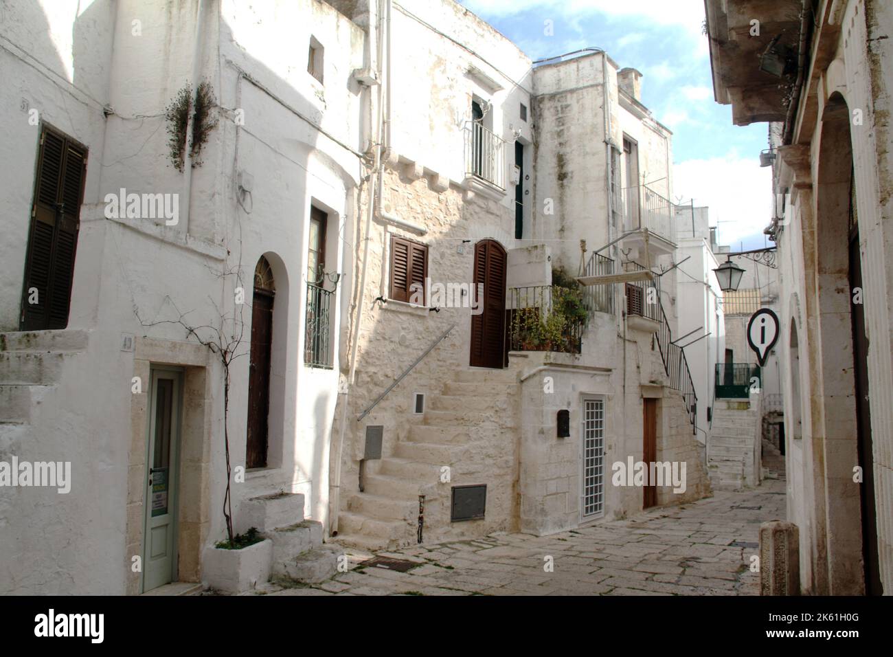 Cisternino, Puglia, Italy. Whitewashed stone buildings with outer ...
