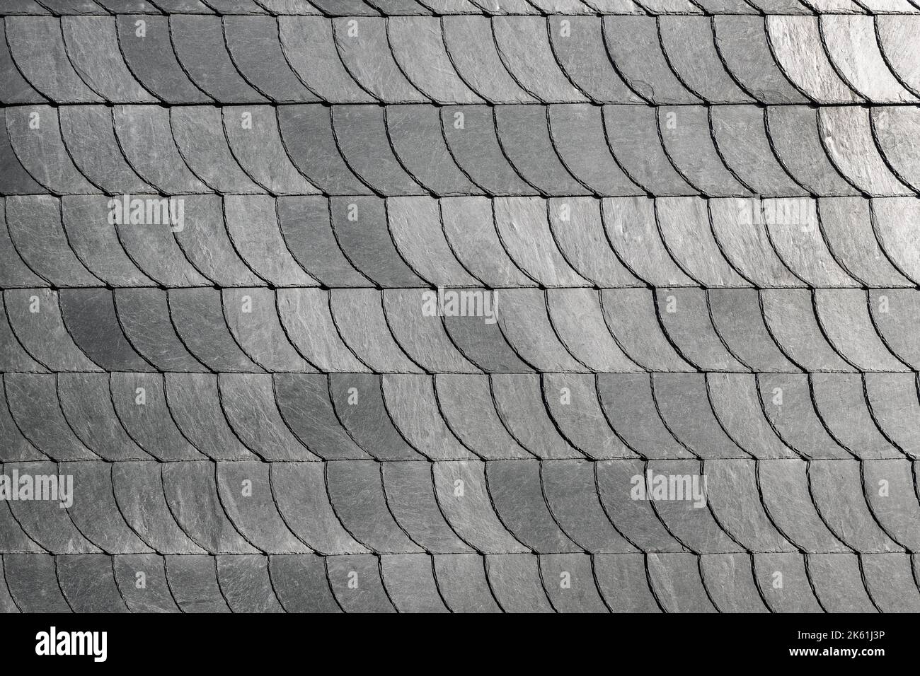 Detail close-up of natural grey stone shingle slate tiles texture roof ...