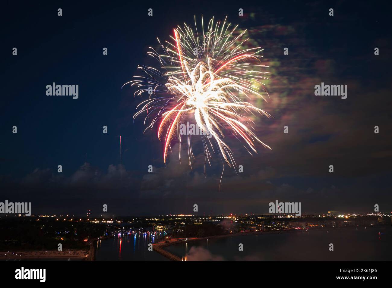 Aerial view of bright fireworks exploding with colorful lights against ...