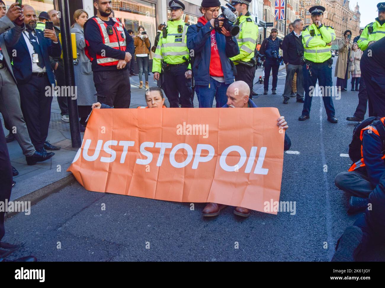 London, England, UK. 11th Oct, 2022. Just Stop Oil activists glue ...