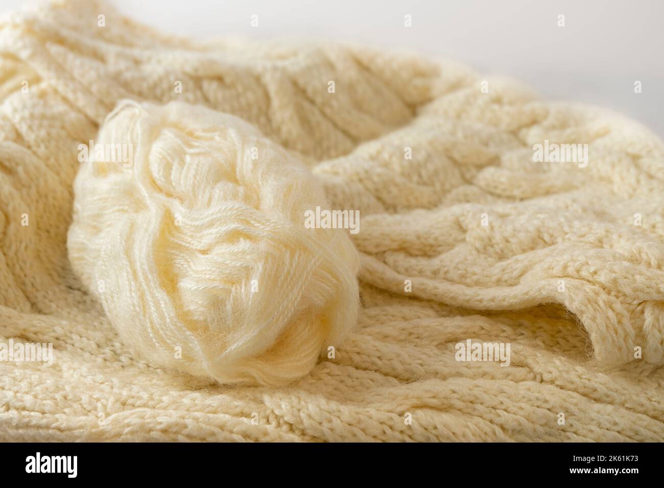 Handmade knitted hobby background with knitted blanket or scarf and ...