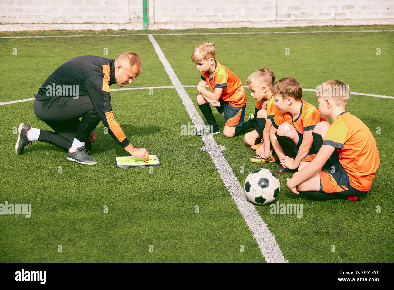Junior football team coach hi-res stock photography and images - Alamy