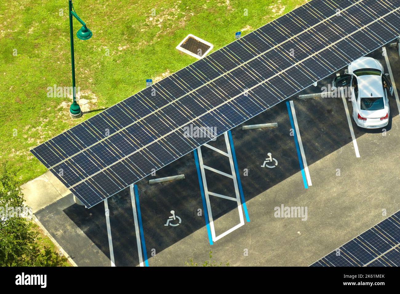 Solar panels installed over parking lot for parked cars for effective ...