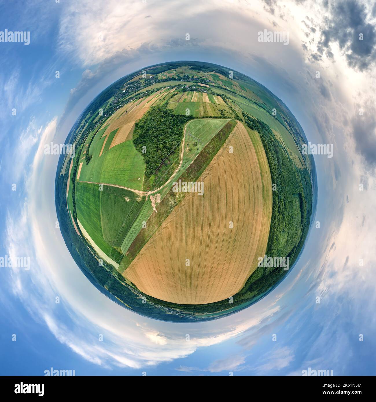 Aerial view from high altitude of little planet earth with green and ...