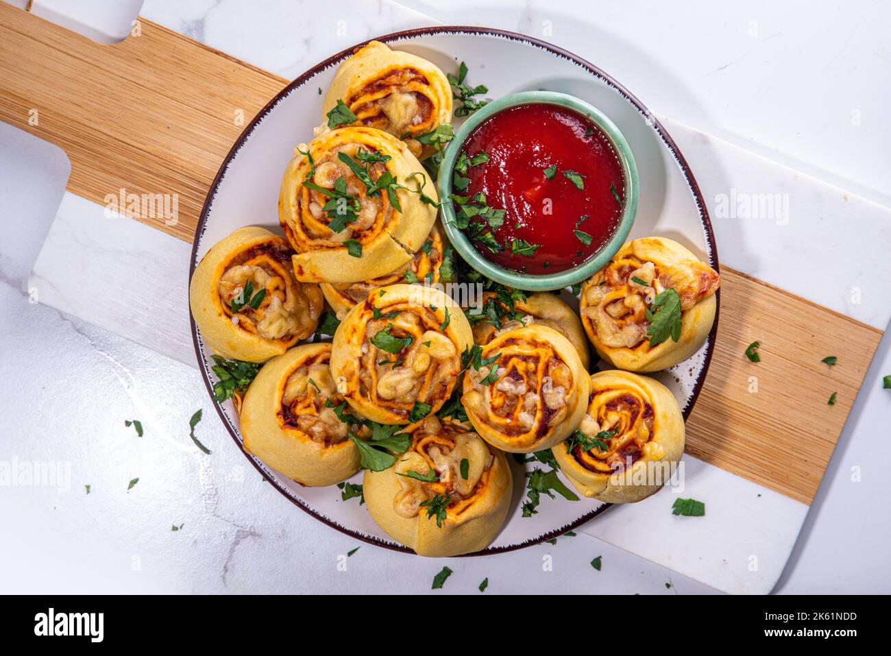 Homemade twisted Pizza rolls with tomato sauce, tomato, and cheese ...