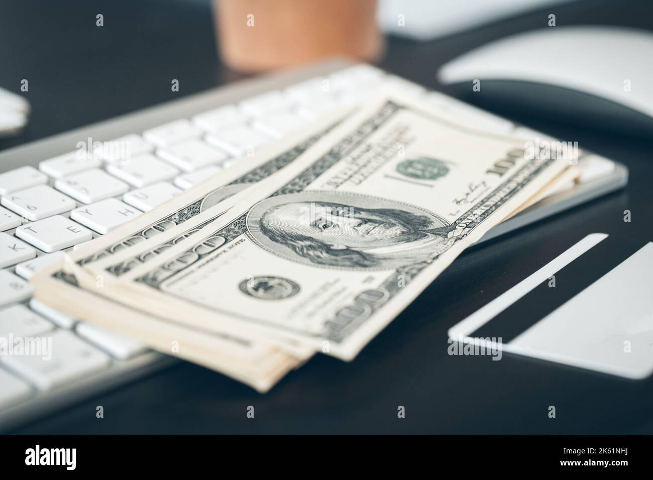 US dollar banknotes put on a computer keyboard close up Stock Photo - Alamy