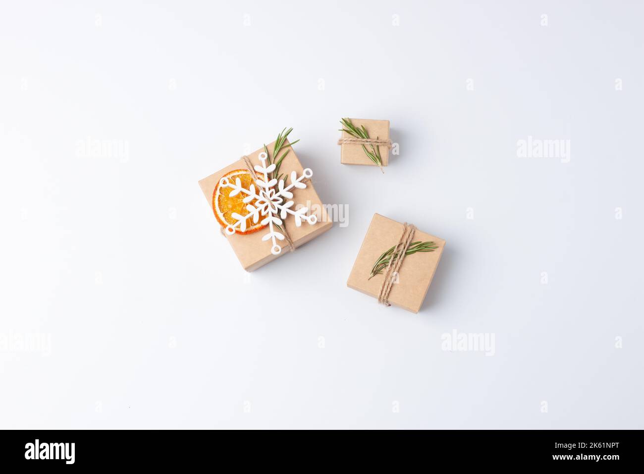 Christmas minimal composition with packaging gifts in craft paper and ...