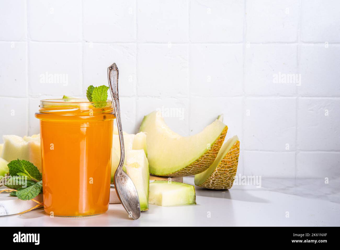 Sweet melon jam, homemade jelly preserves in small glass jar with fresh ...
