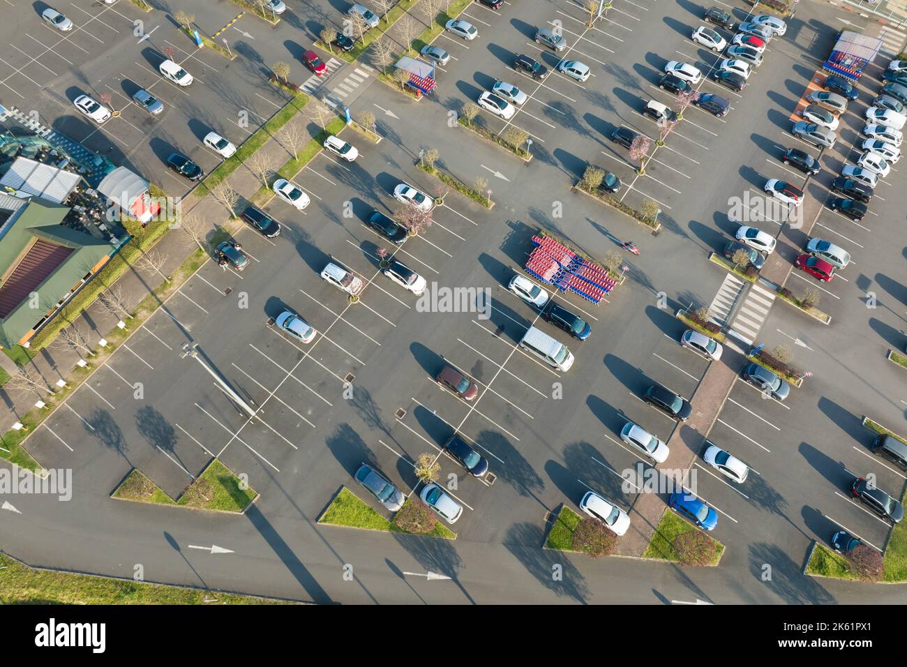 Aerial view of many colorful cars parked on parking lot with lines and ...