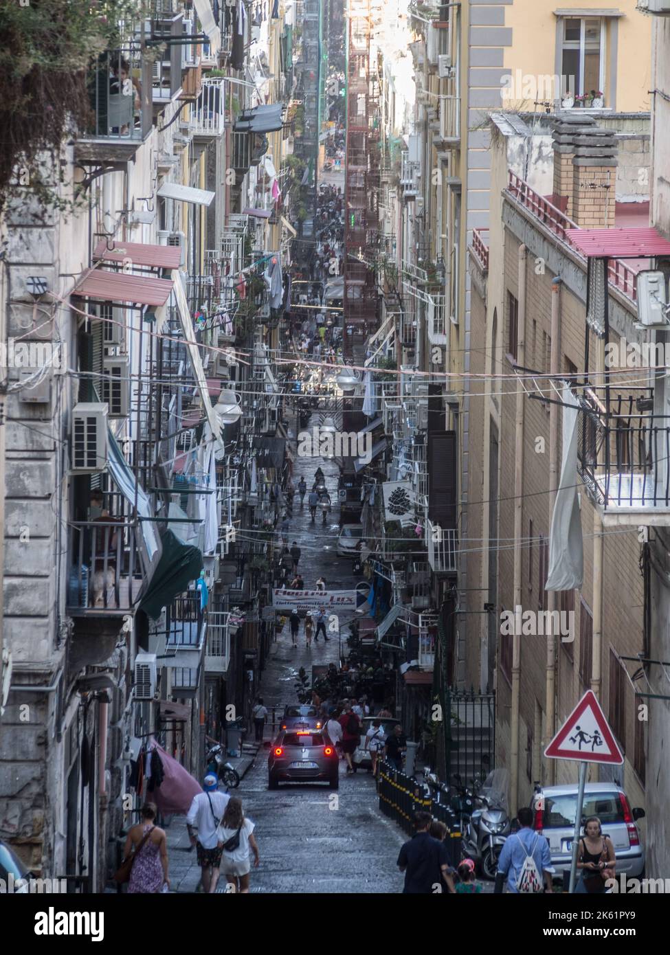 The narrow streets of Naples full of people Stock Photo - Alamy