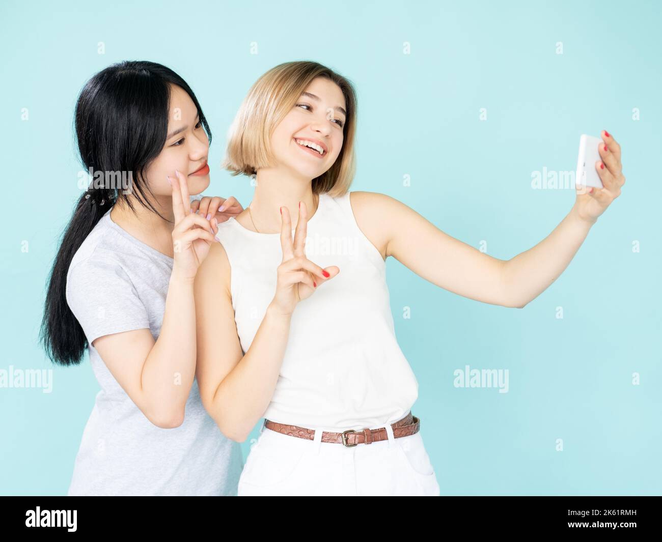 Asian Tourists Peace Sign