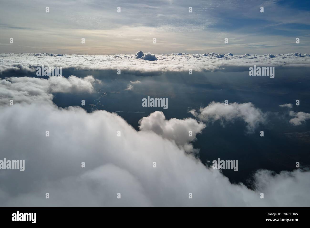 Aerial view from airplane window at high altitude of earth covered with ...