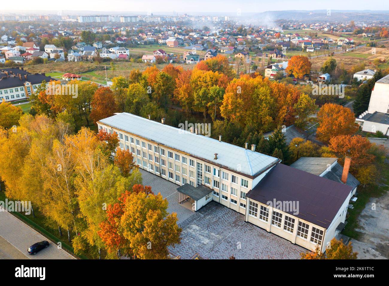 Aerial view of school, college or kindergarten building with big yard ...