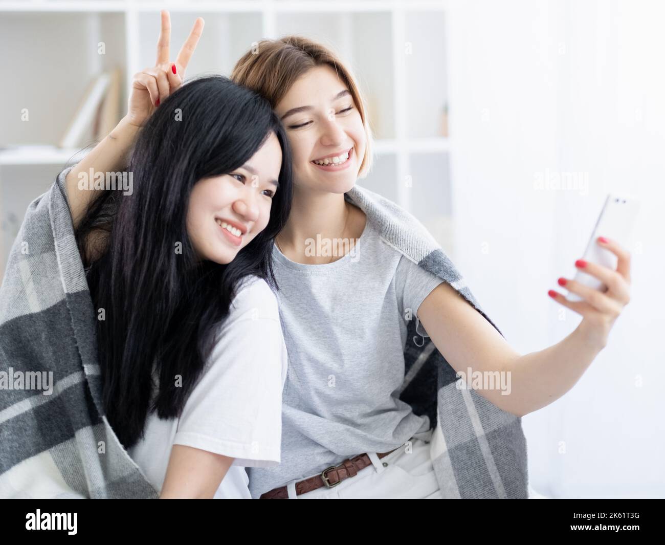 happy female friends home party ethnic diversity Stock Photo - Alamy