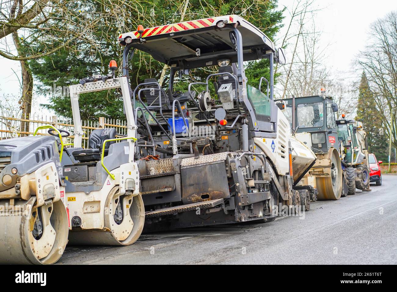 UK roadworking equipment, including large road rollers, parked outdoors ...