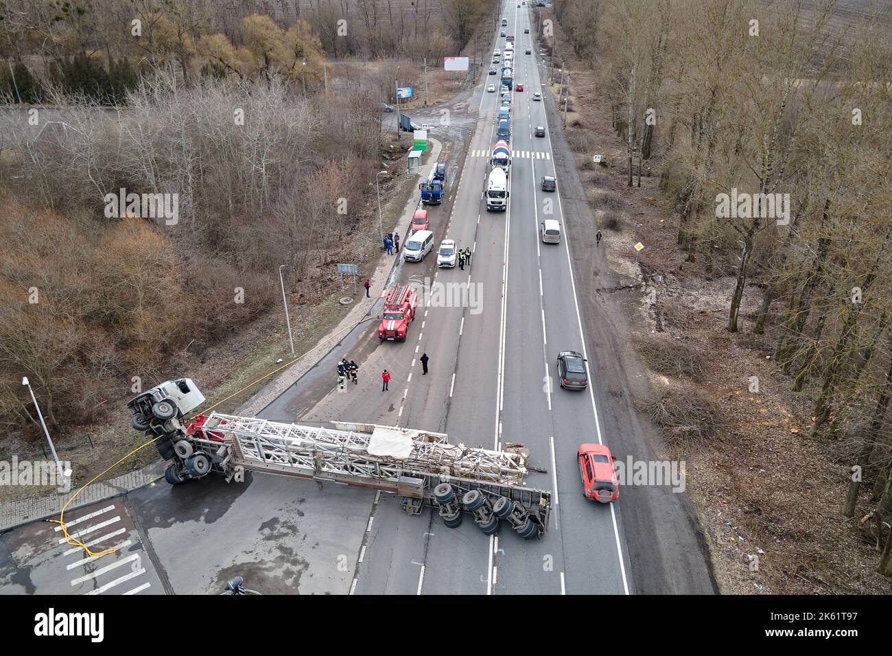 Aerial view of road accident with overturned truck blocking traffic ...