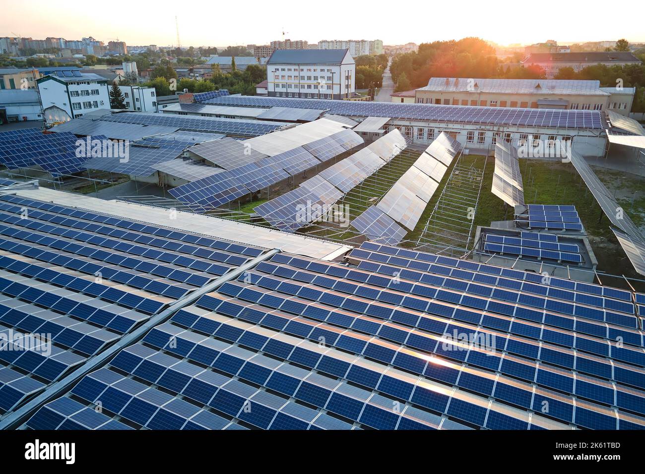 Aerial view of solar power plant with blue photovoltaic panels mounted ...