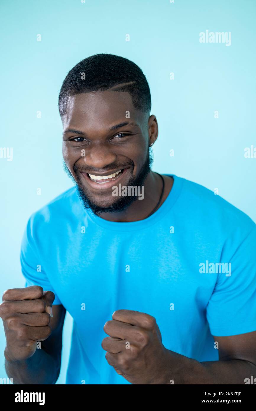 Happy man celebrating success achievement hi-res stock photography and ...