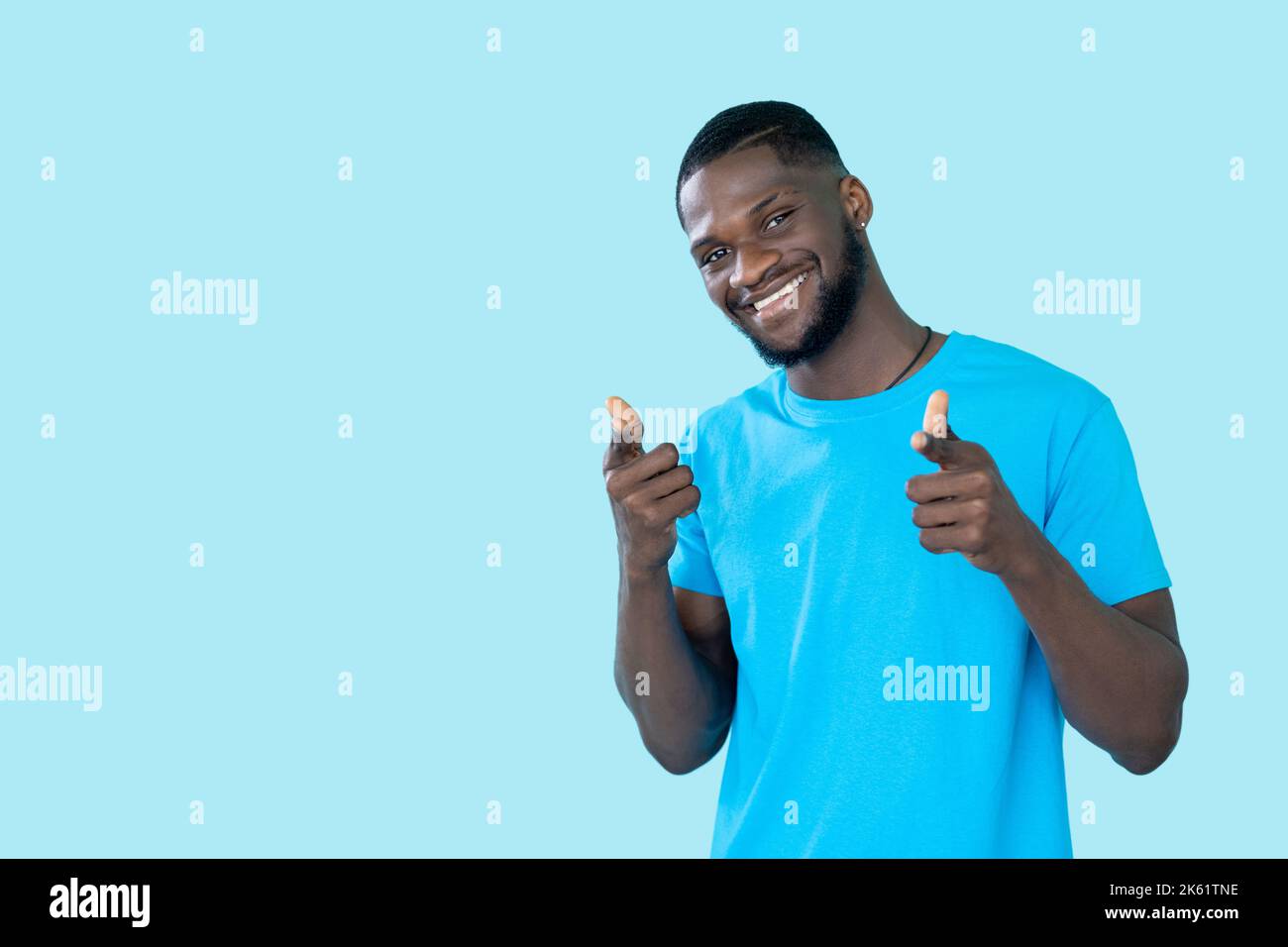 African man pointing camera inviting hi-res stock photography and ...