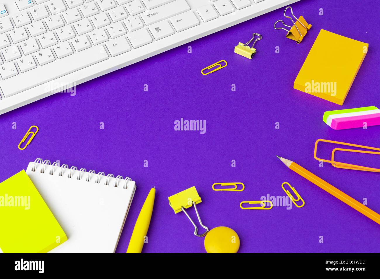 Composition of office lifestyle items on purple background, computer ...
