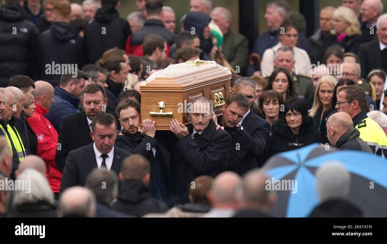 Mourners carrying the coffin of Martin McGill outside St Michael's ...