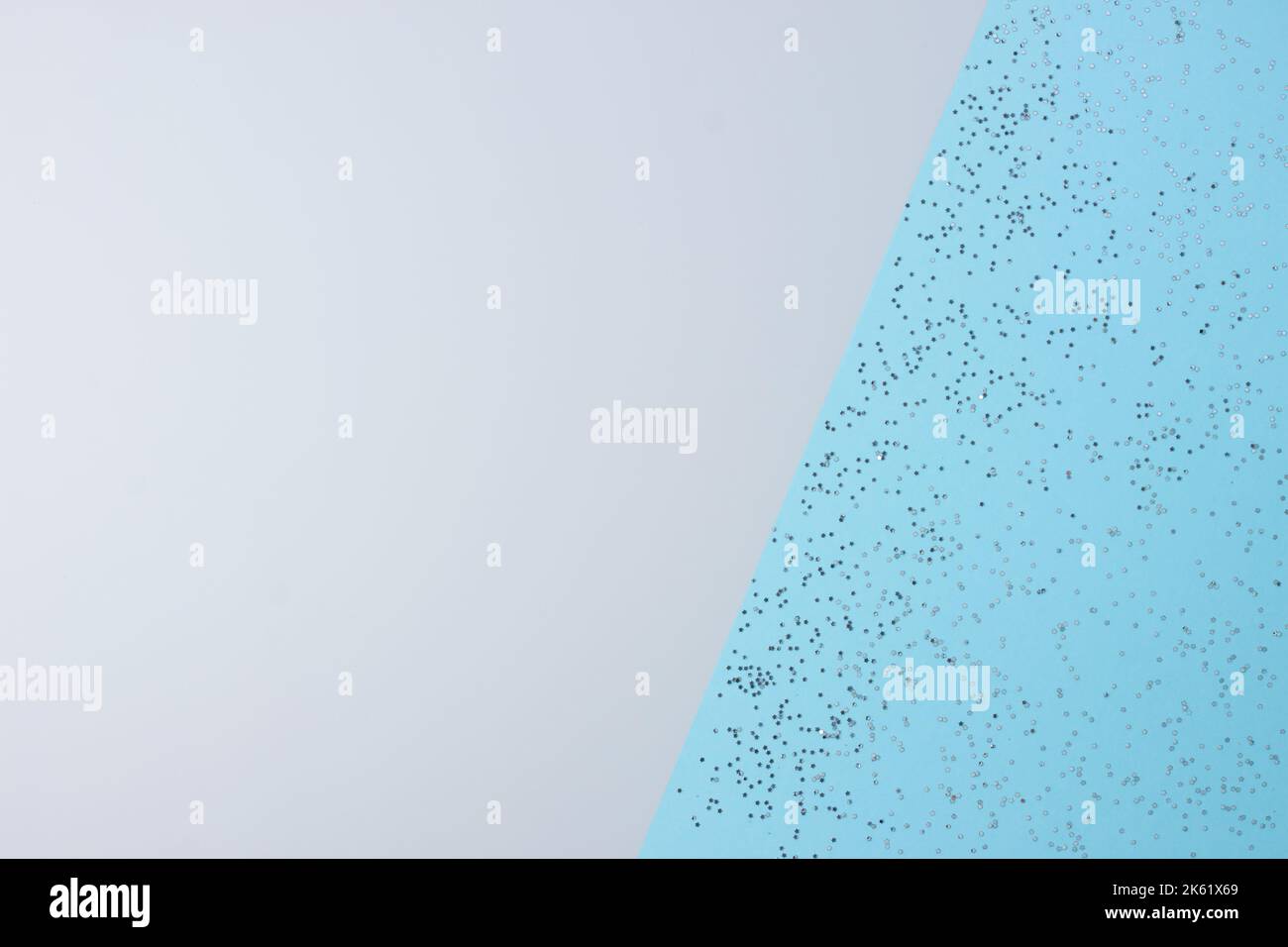 Christmas grey and blue minimal background with confetti. Flat lay ...