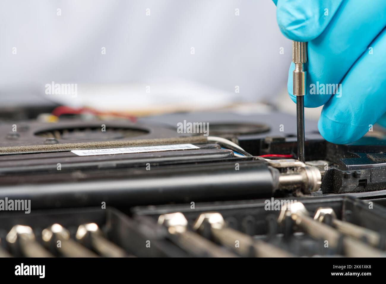 Hands of a technician repairing a broken laptop computer Stock Photo ...