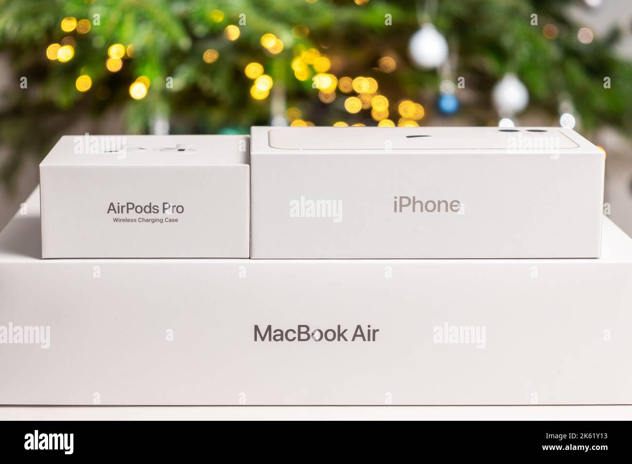 Apple boxes with iPhone, AirPods pro, iPad pro, MacBook Air with a red ...