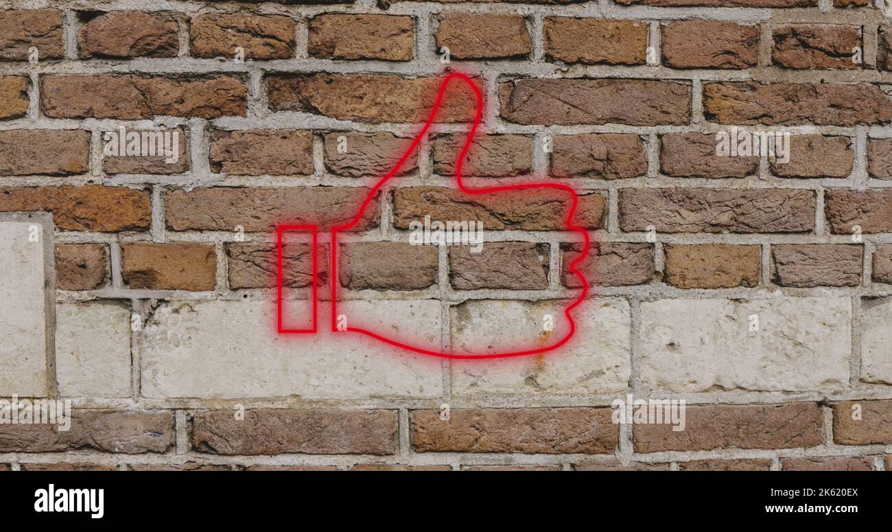 Composite of digital red like button icon against brick wall, copy ...