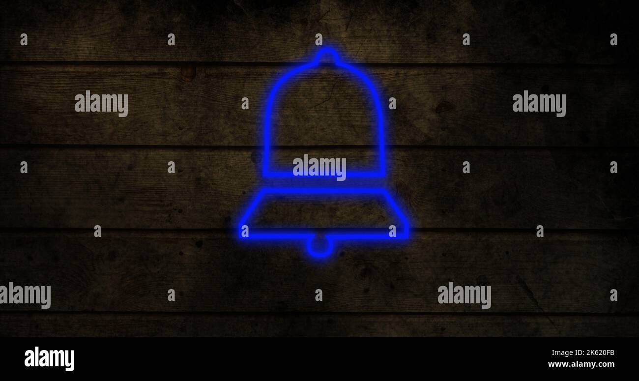 Composite of digital blue notification bell icon glowing against wooden ...
