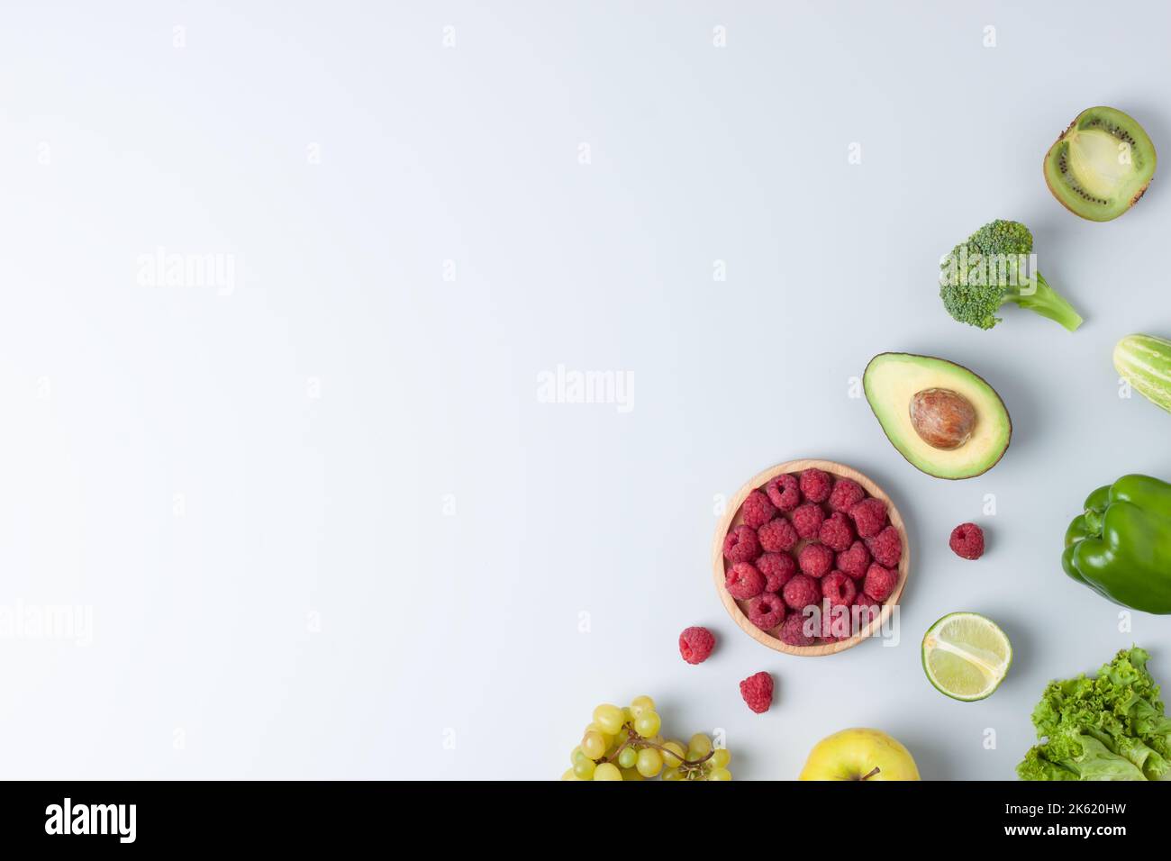 Fresh fruits and vegetables on grey background. Healthy eating concept ...