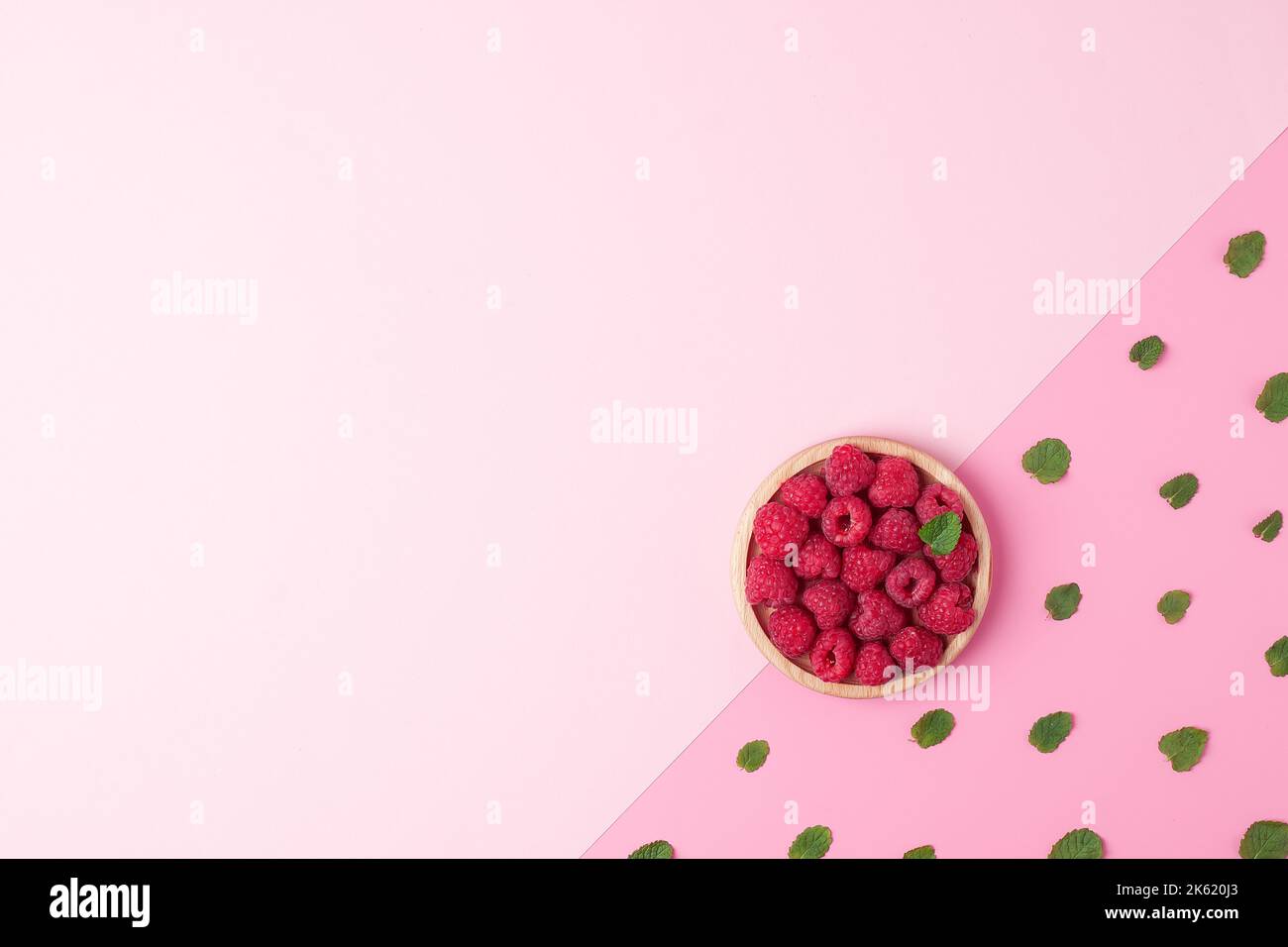 Creative summer background made from fresh berries and mint on pink ...