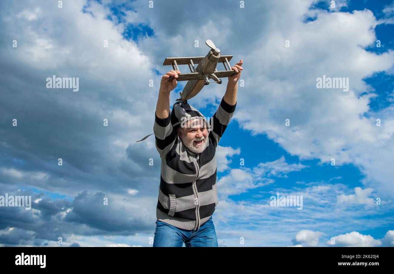 happy retirement. surprised granddad with toy. retired old man outdoor ...