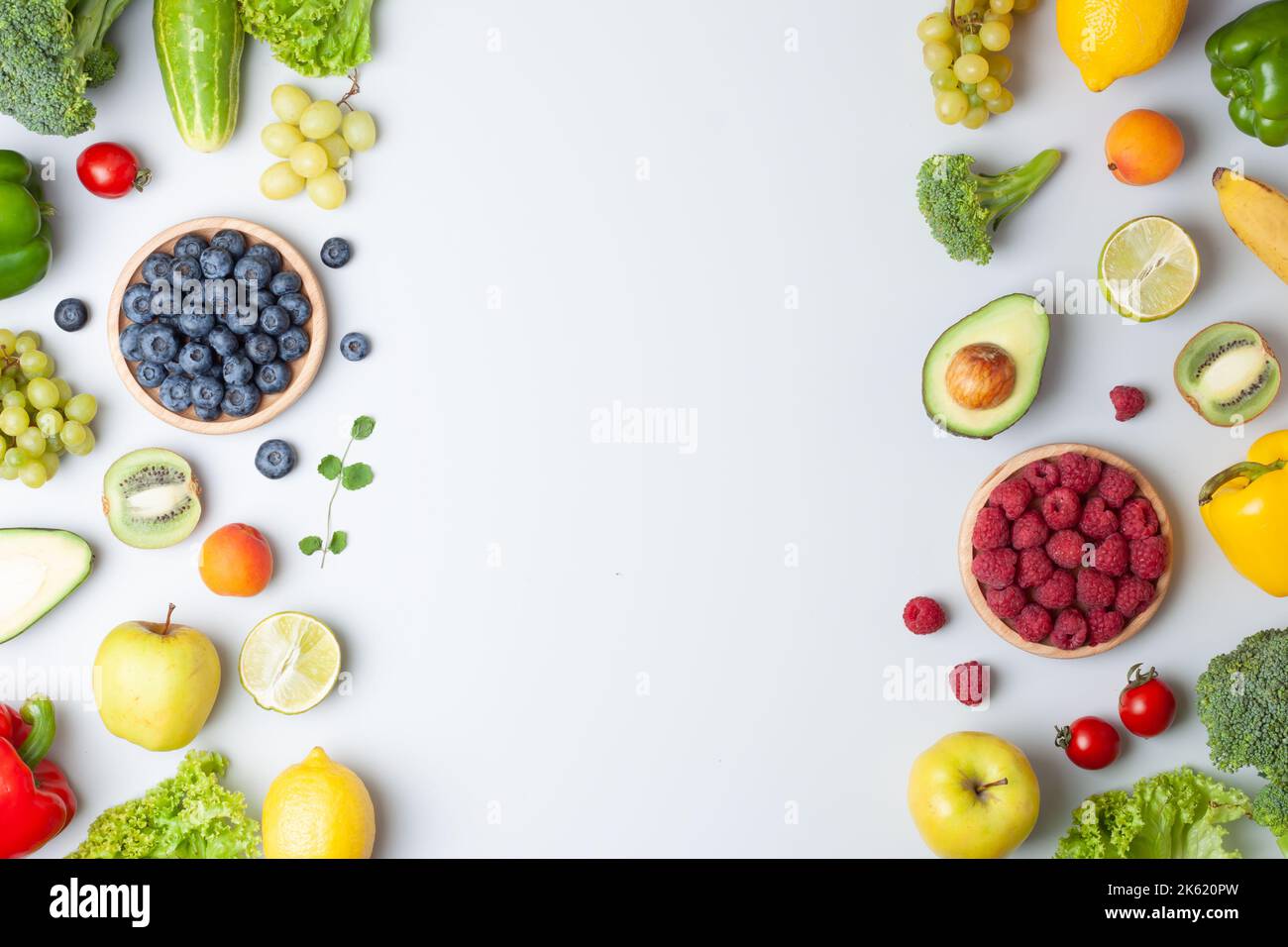 Fresh fruits and vegetables on grey background. Healthy eating concept ...