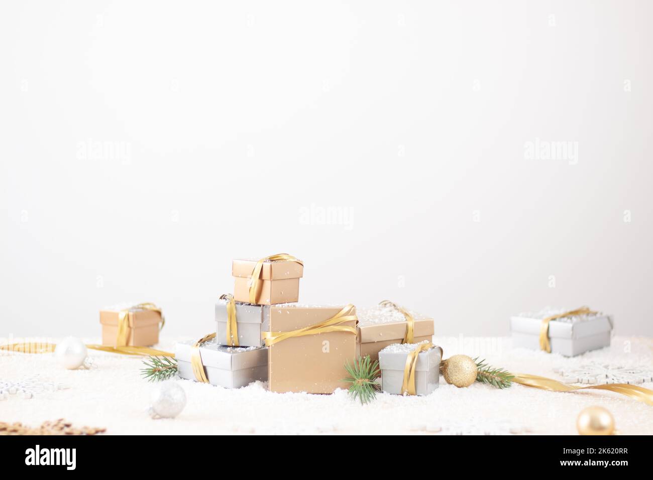 Christmas decorations with gold ribbon and balls on pastel beige ...
