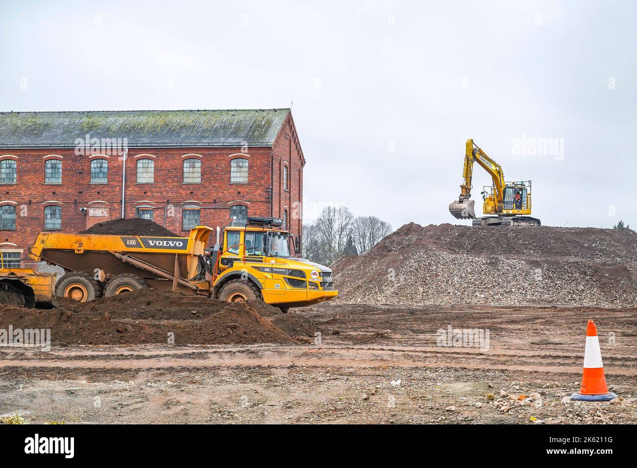 Heavy construction equipment being used in a rejuvenation project on a ...