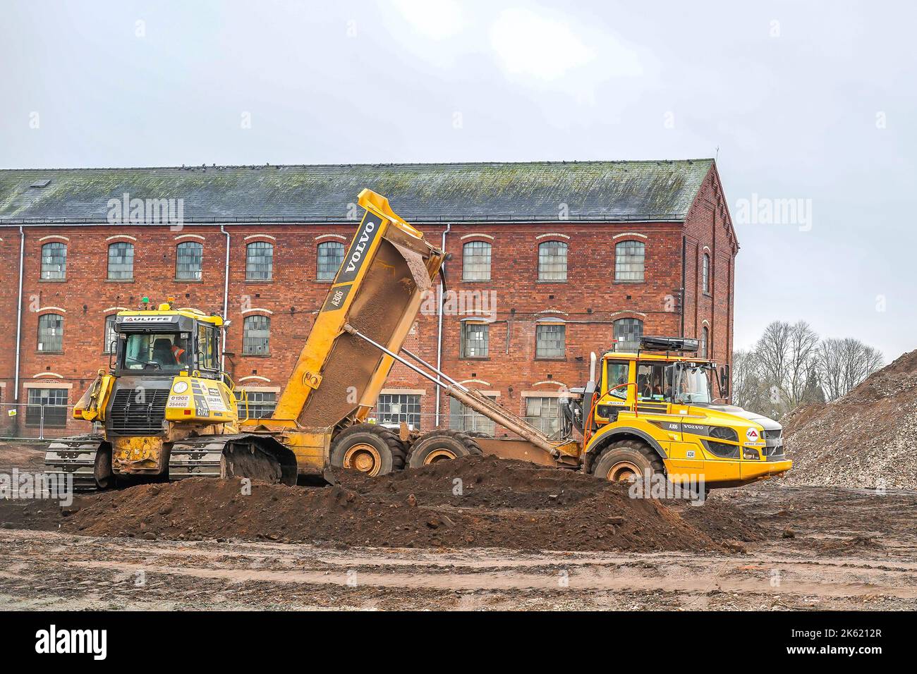 Heavy construction equipment working in an urban rejuvenation project ...